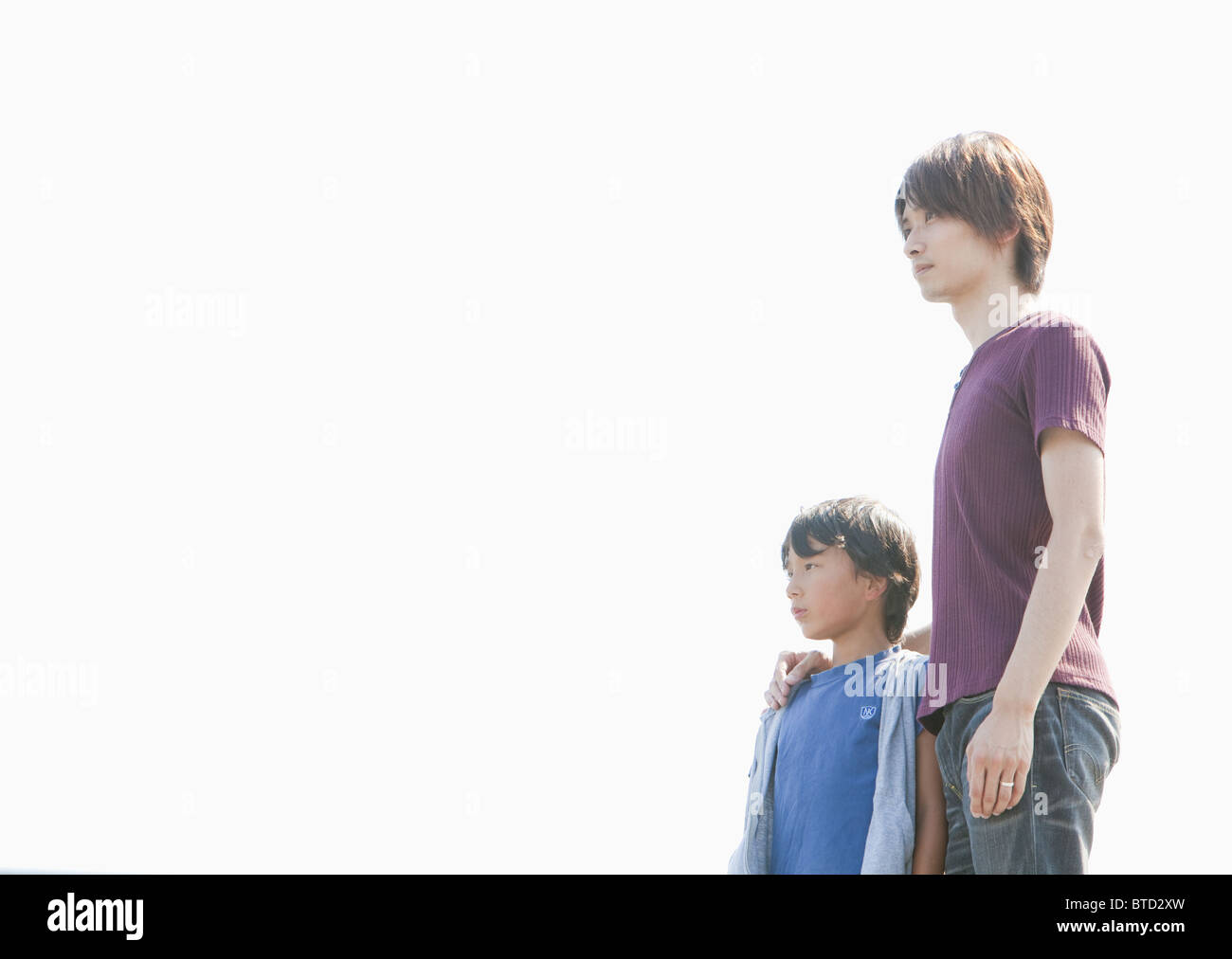 Father and son standing Stock Photo - Alamy