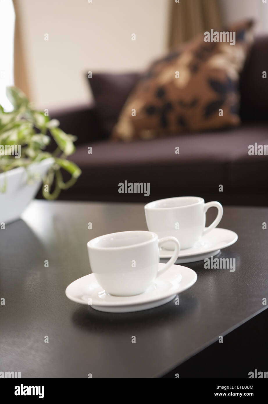 Coffee cups on table Stock Photo - Alamy