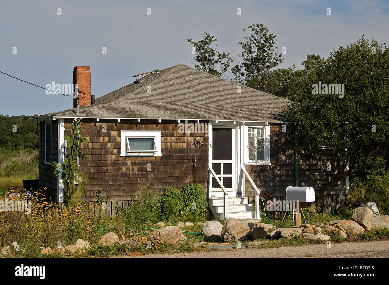 A small, shingled cottage Stock Photo - Alamy