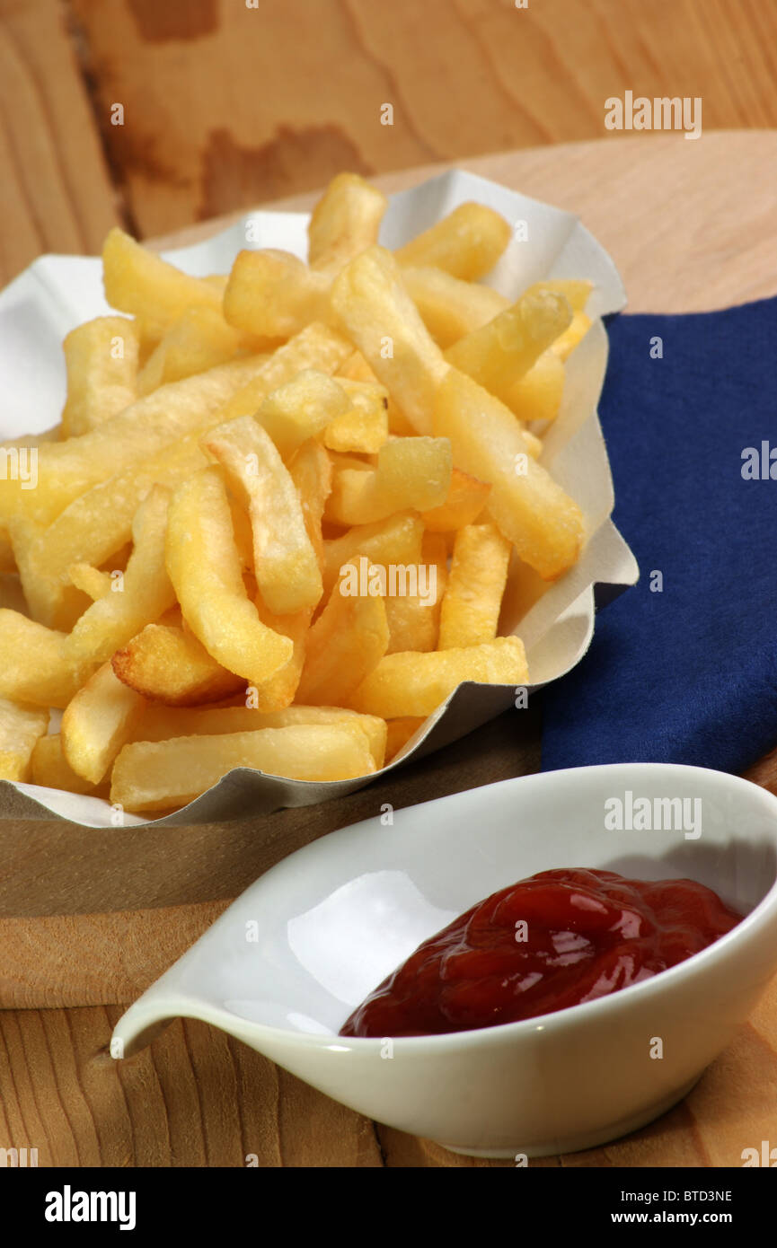fat chips with ketchup on a paper plate Stock Photo - Alamy