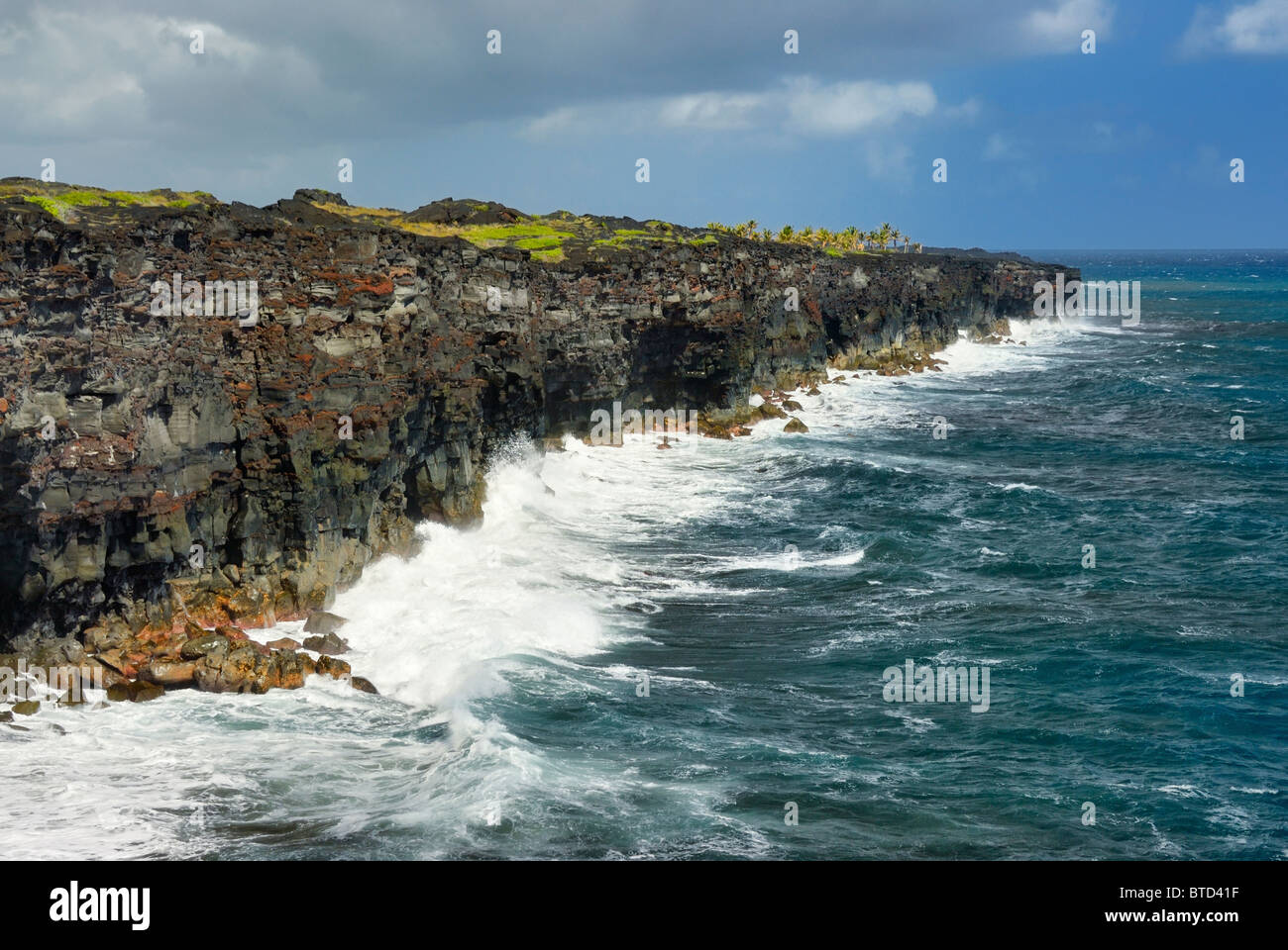 Cliffs and windswept coast created by lava. Chain of Craters Road ...