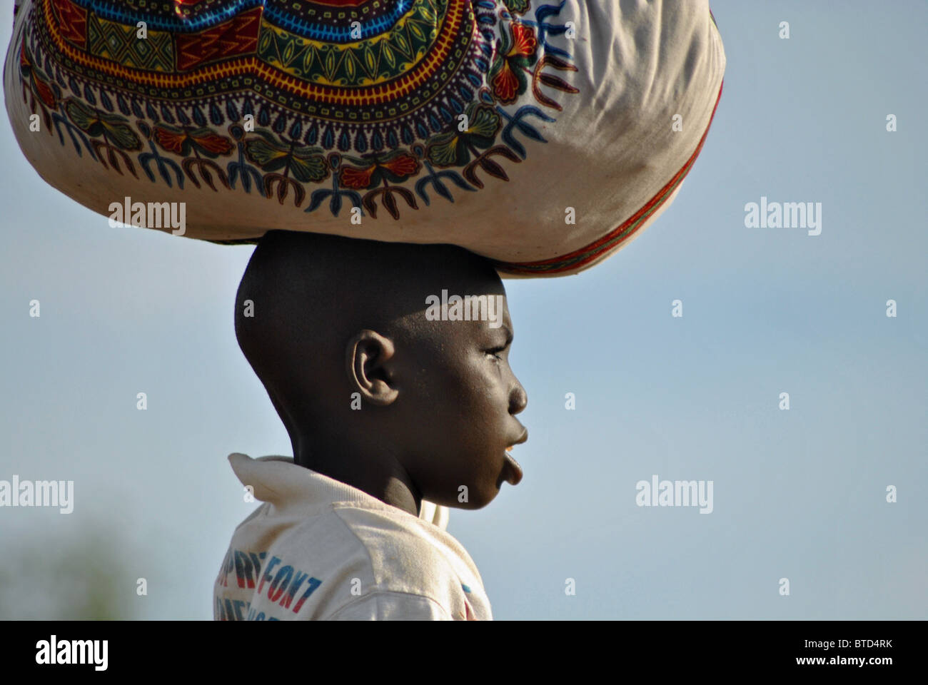 Children carrying heavy load hi-res stock photography and images - Alamy