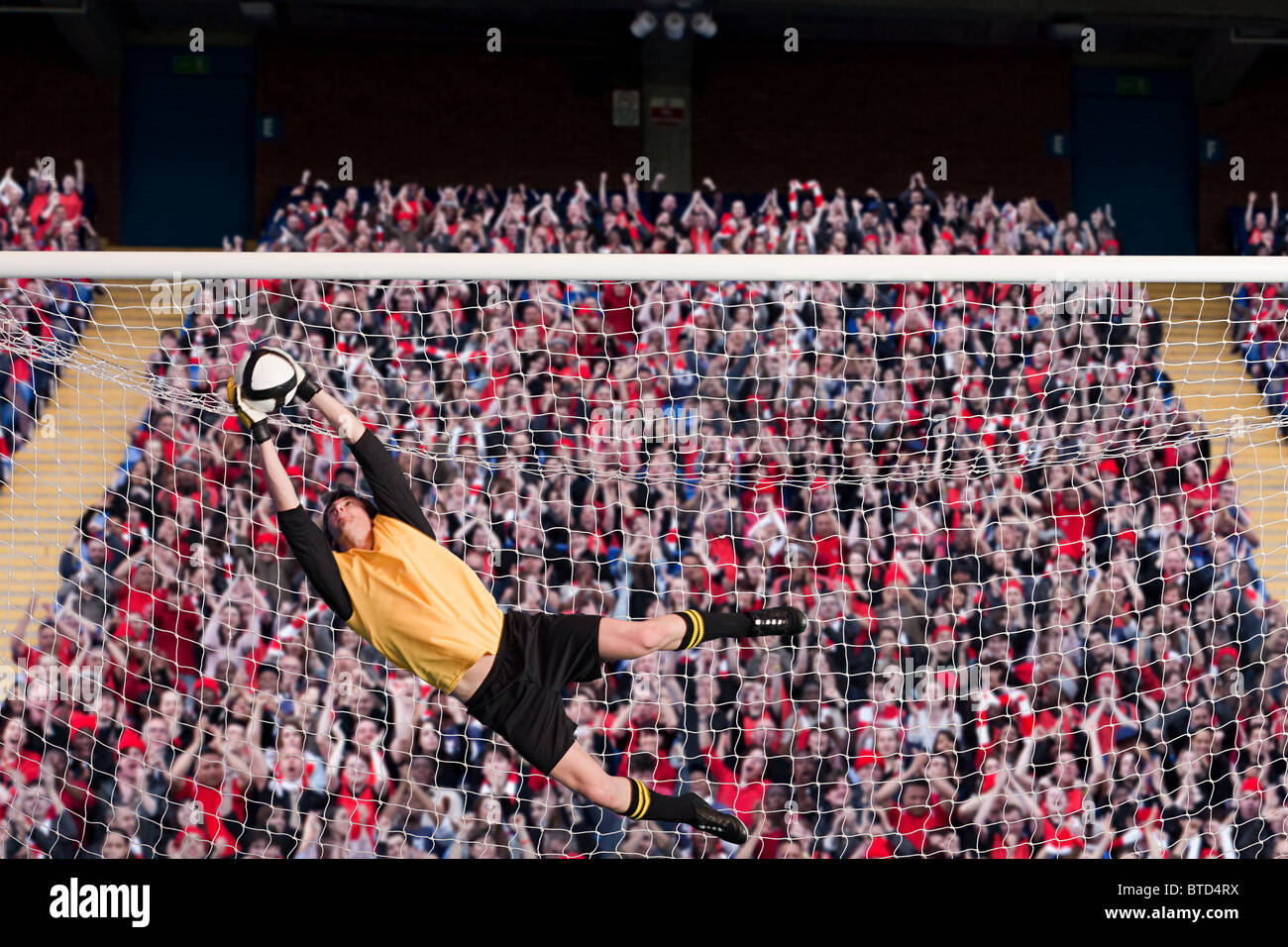 Goalkeeper saving a goal Stock Photo - Alamy