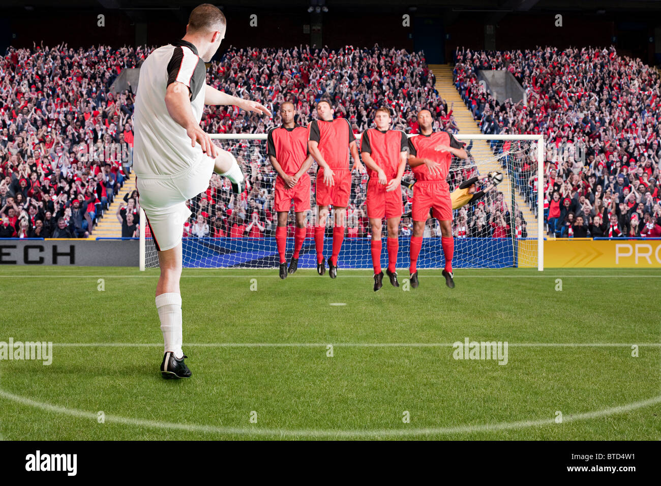 Football taking a free kick Stock Photo - Alamy