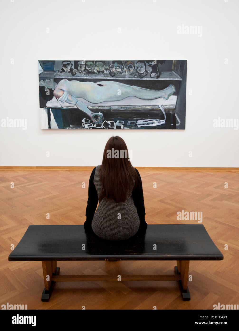 Woman looking at painting Snow White and the broken arm by Marlene ...