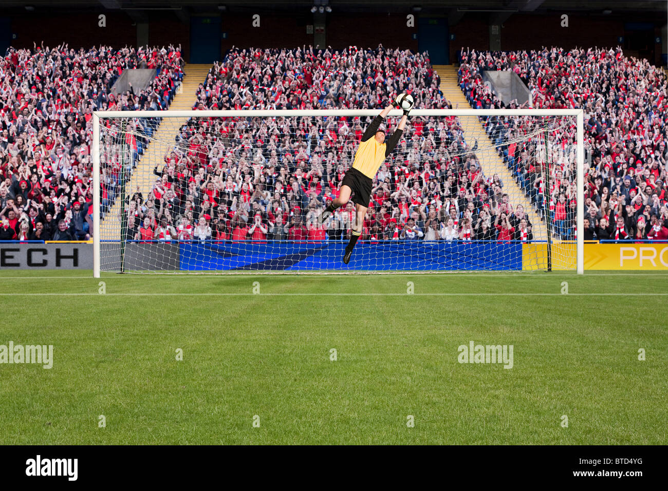 Goalkeeper saving a goal Stock Photo - Alamy