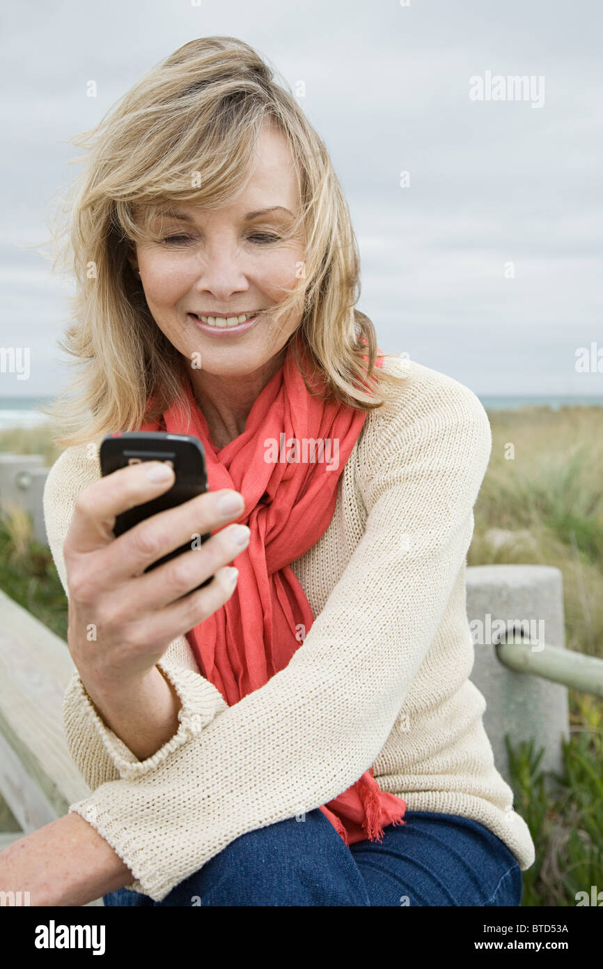 Woman using cellphone Stock Photo - Alamy
