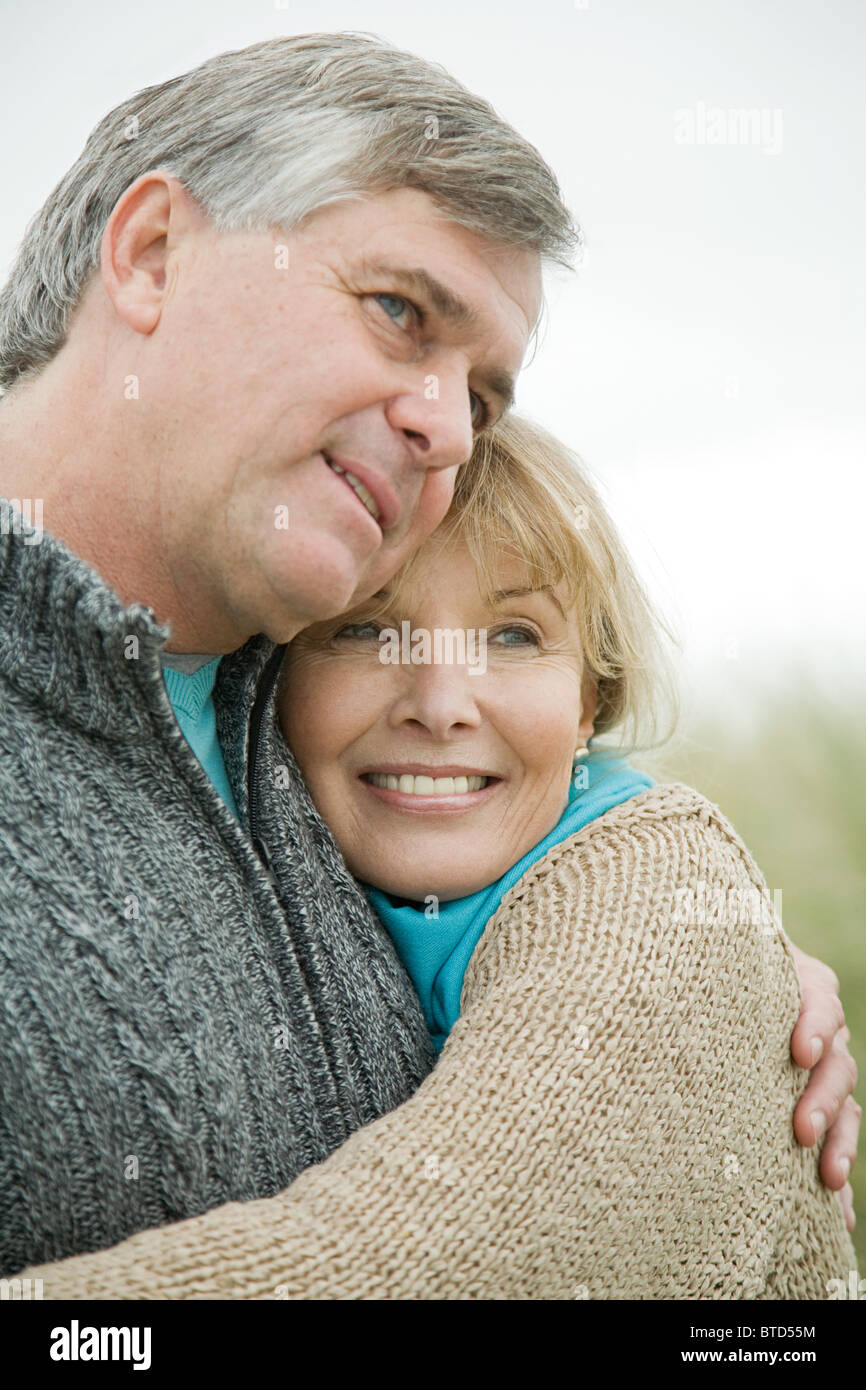 Mature couple hugging Stock Photo - Alamy