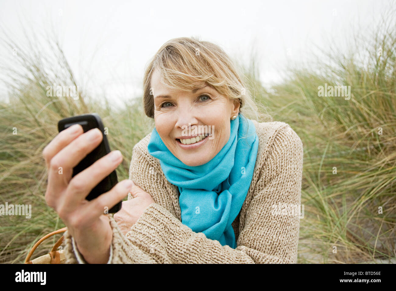 Woman with a smartphone Stock Photo - Alamy