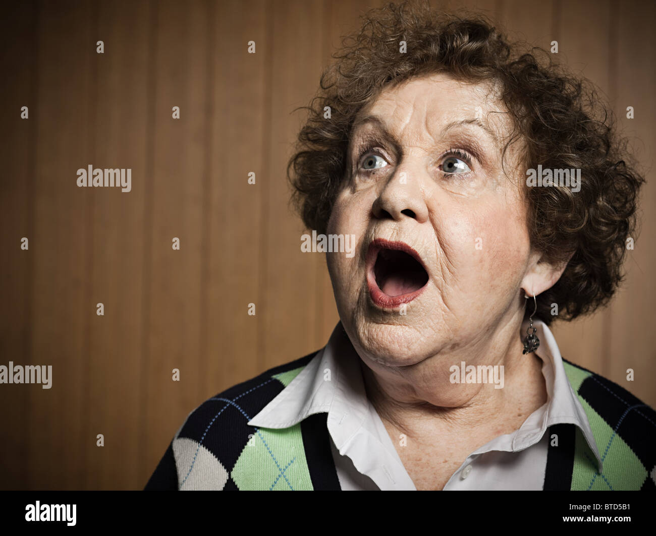 Studio portrait of shocked senior woman Stock Photo - Alamy