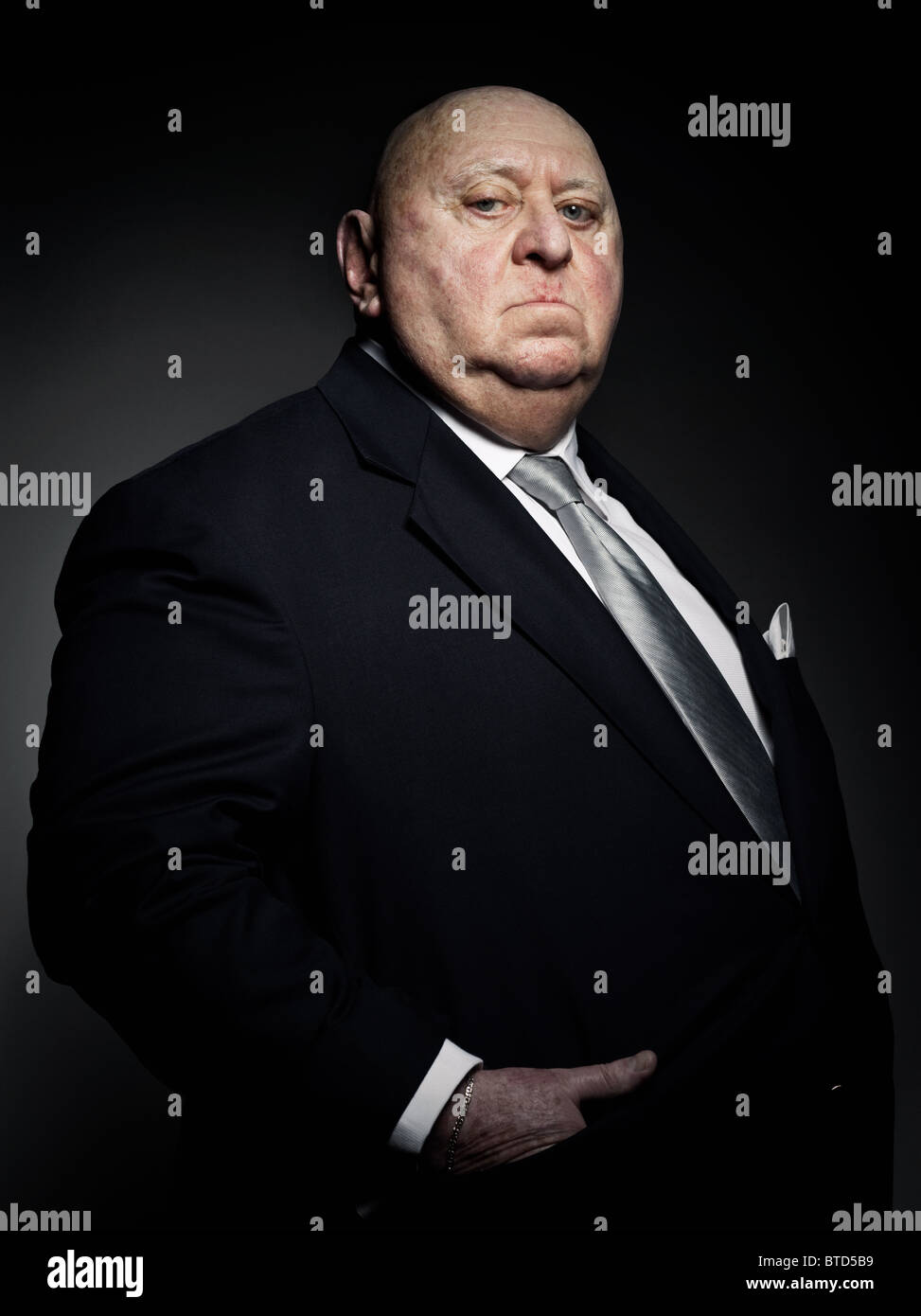 Studio portrait of serious gangster Stock Photo - Alamy