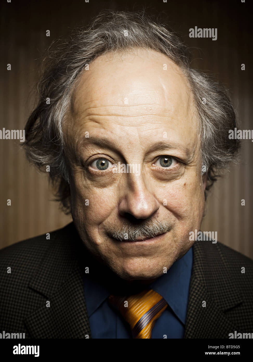 Studio portrait of balding senior man Stock Photo - Alamy