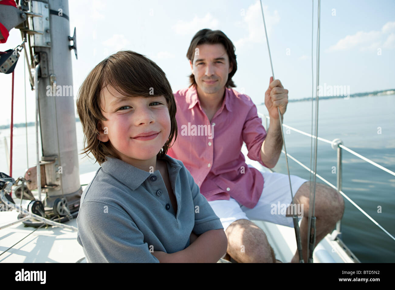 Father and son on board yacht, portrait Stock Photo - Alamy