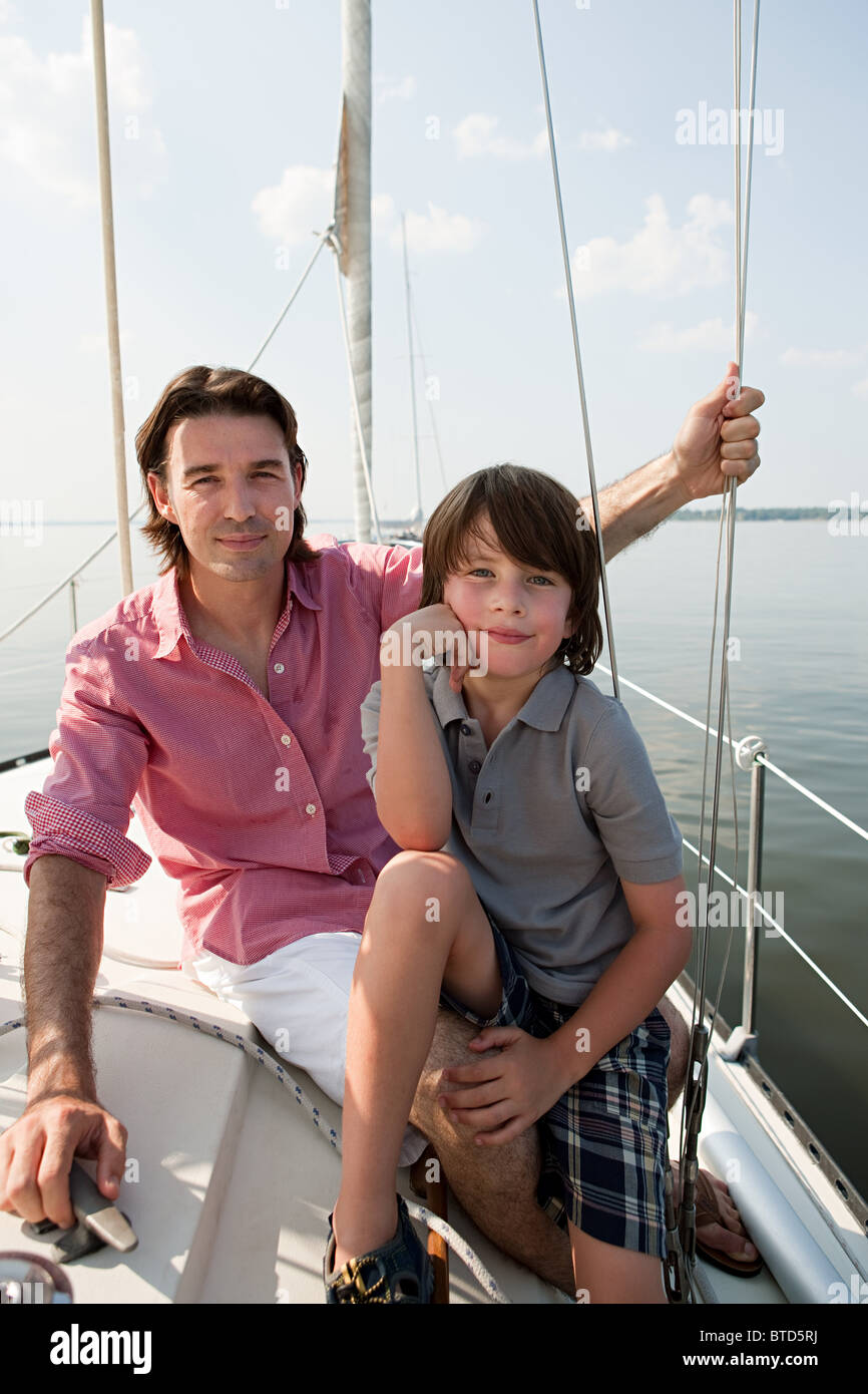 Father and son on board yacht, portrait Stock Photo - Alamy