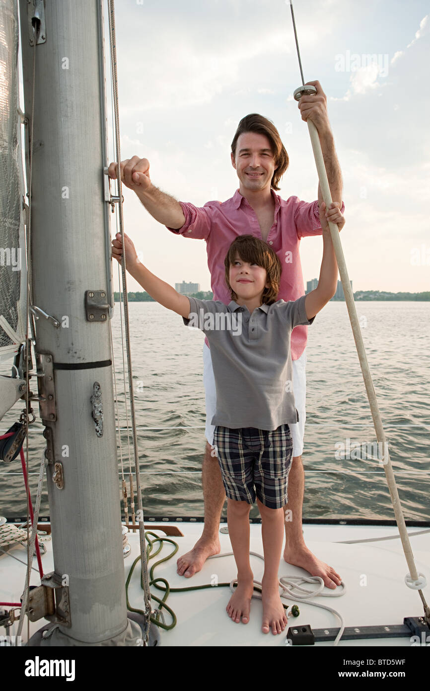 Father and son on board yacht, portrait Stock Photo - Alamy