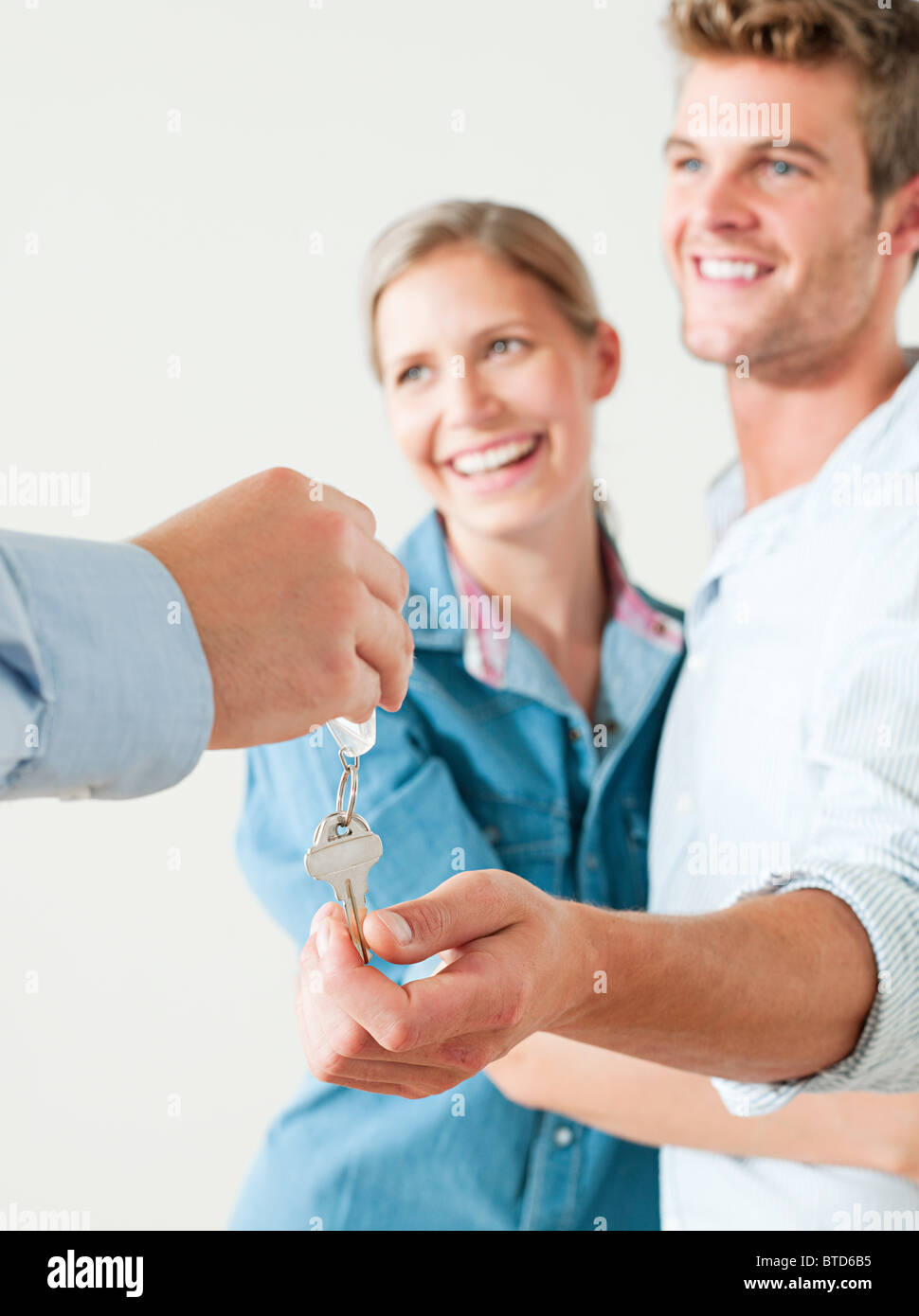 Young couple being handed house keys Stock Photo - Alamy