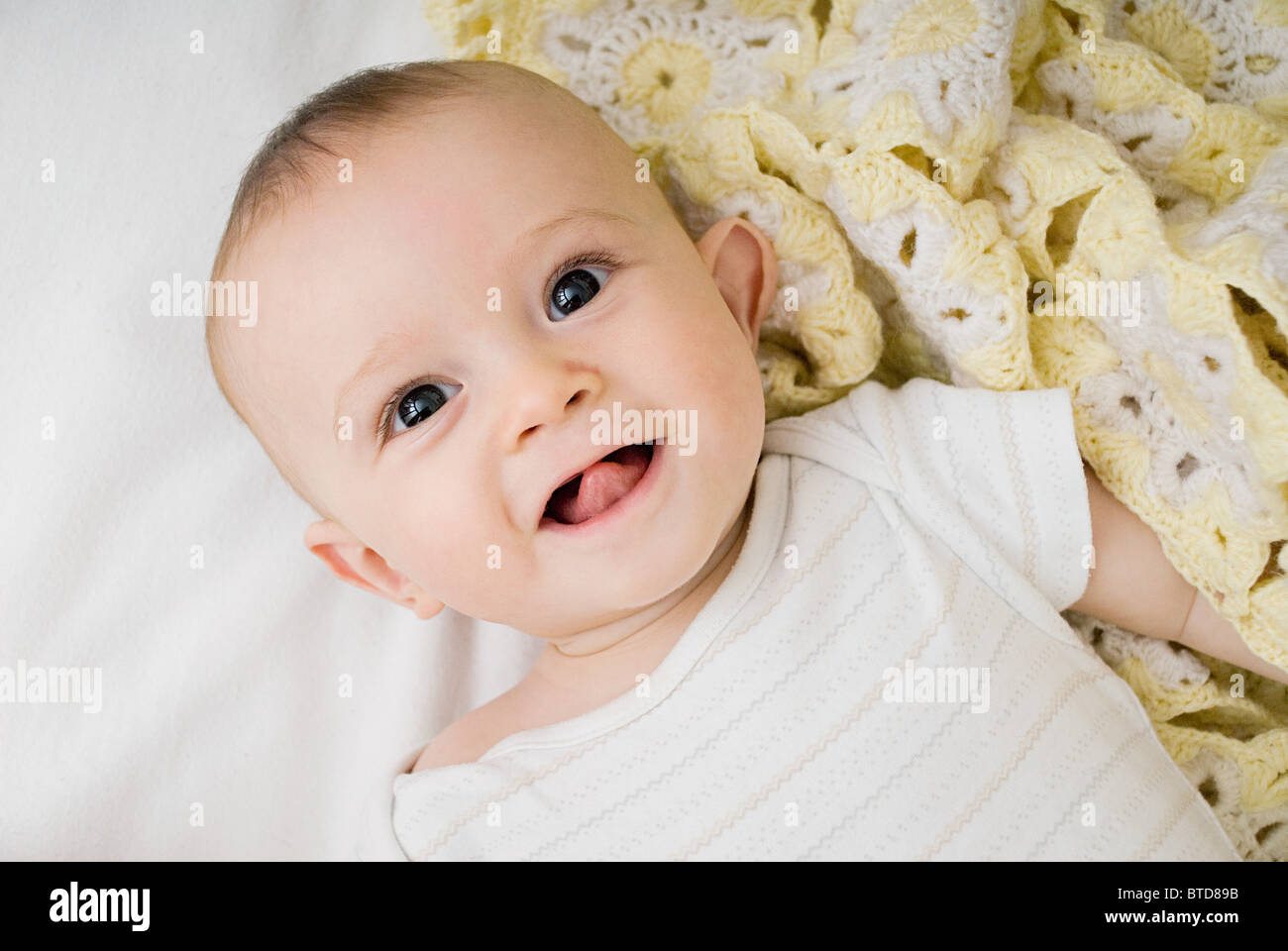 Baby lying on back Stock Photo - Alamy