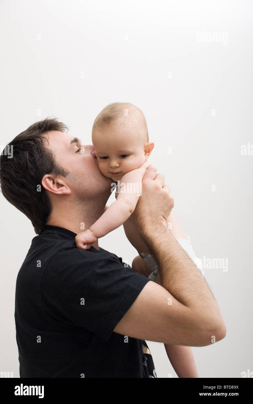 Father holding baby son Stock Photo - Alamy