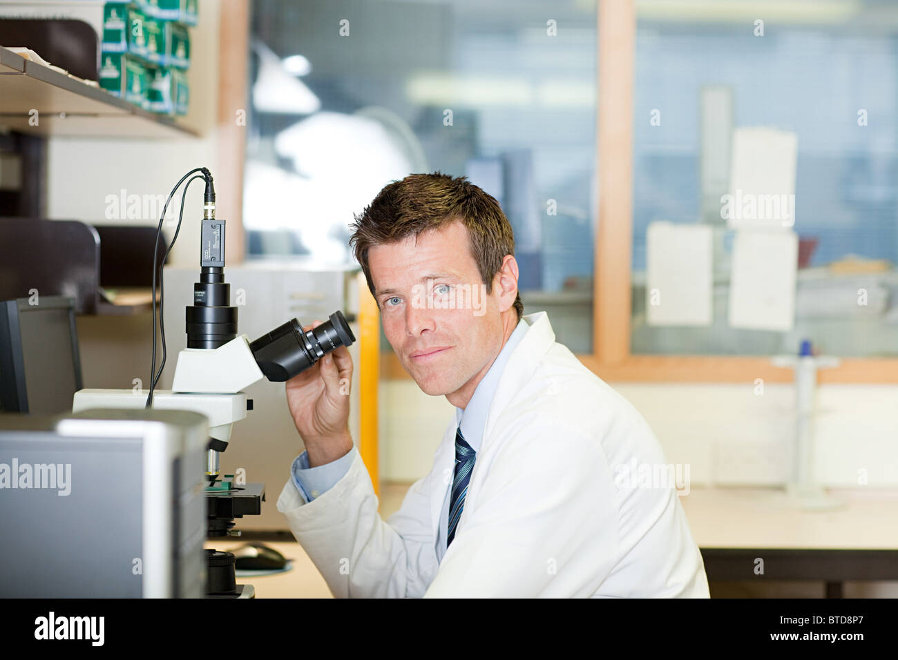 Doctor with microscope Stock Photo - Alamy