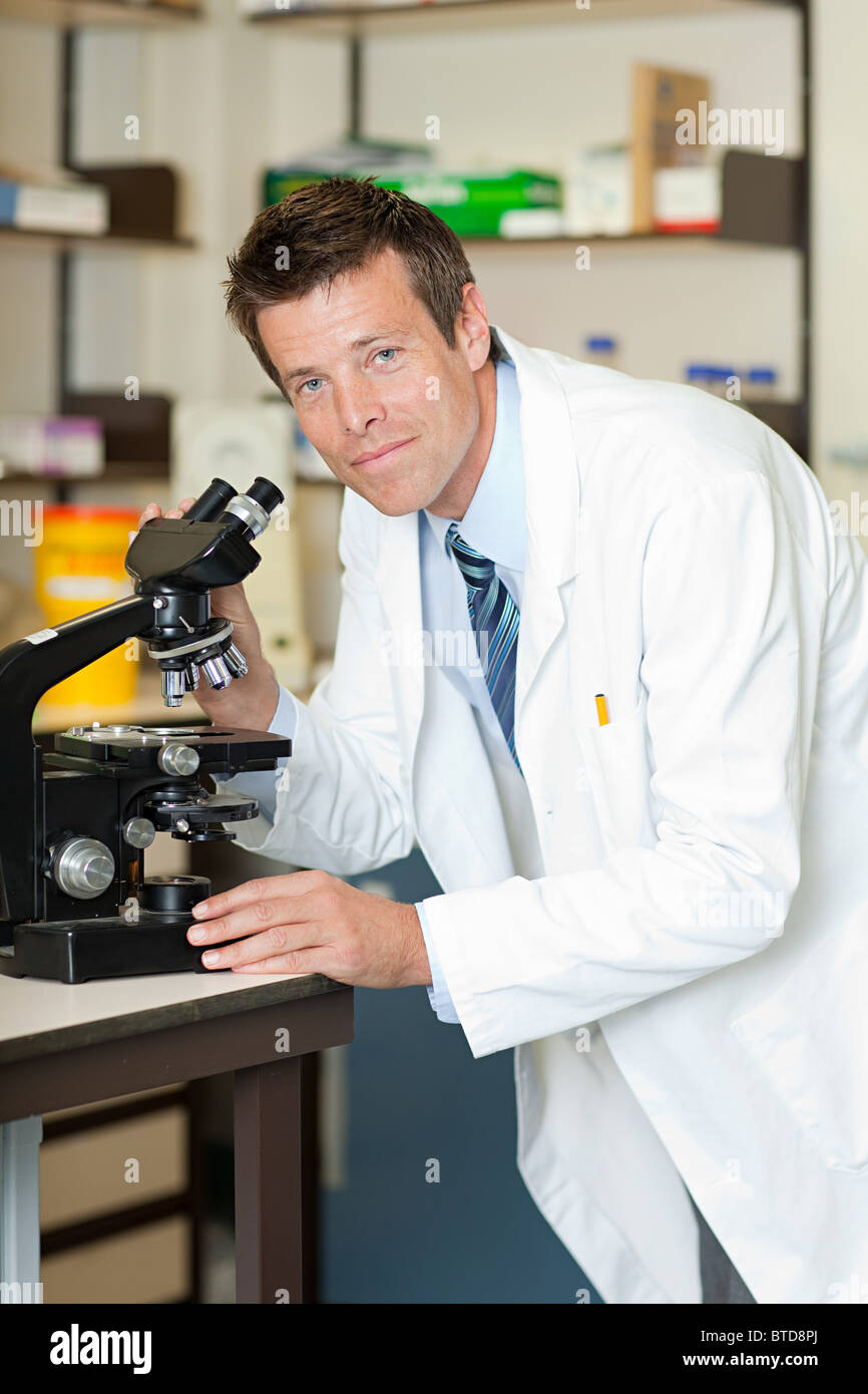Doctor with microscope Stock Photo - Alamy