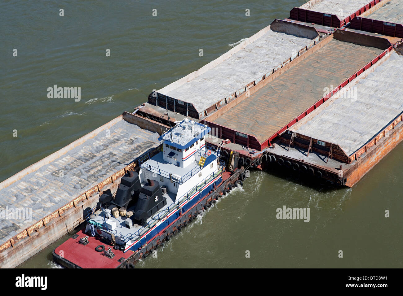 Tugboat and barges Stock Photo - Alamy
