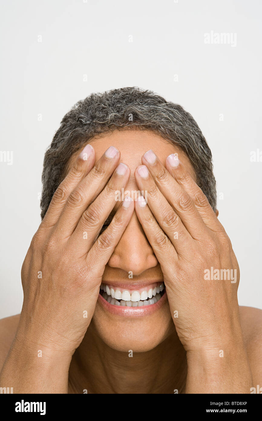 Woman covering eyes Stock Photo - Alamy