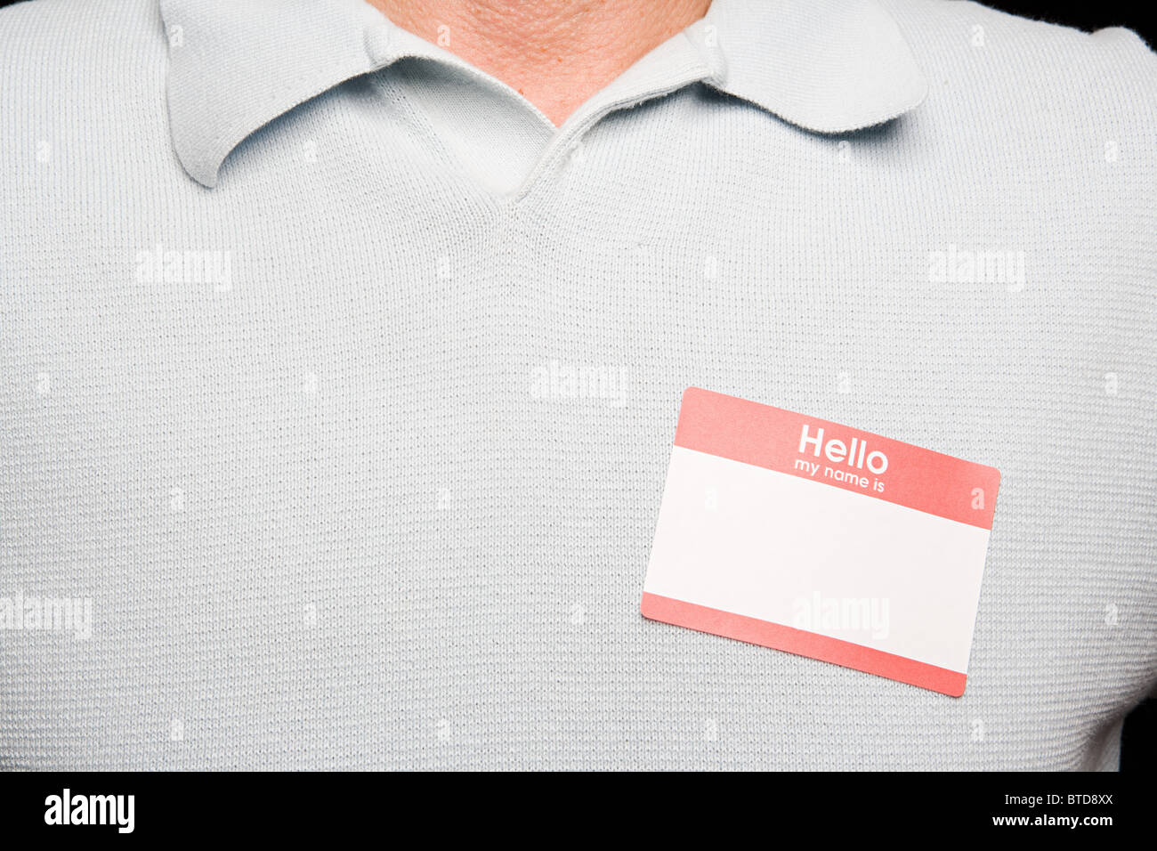 Man with blank name tag Stock Photo - Alamy