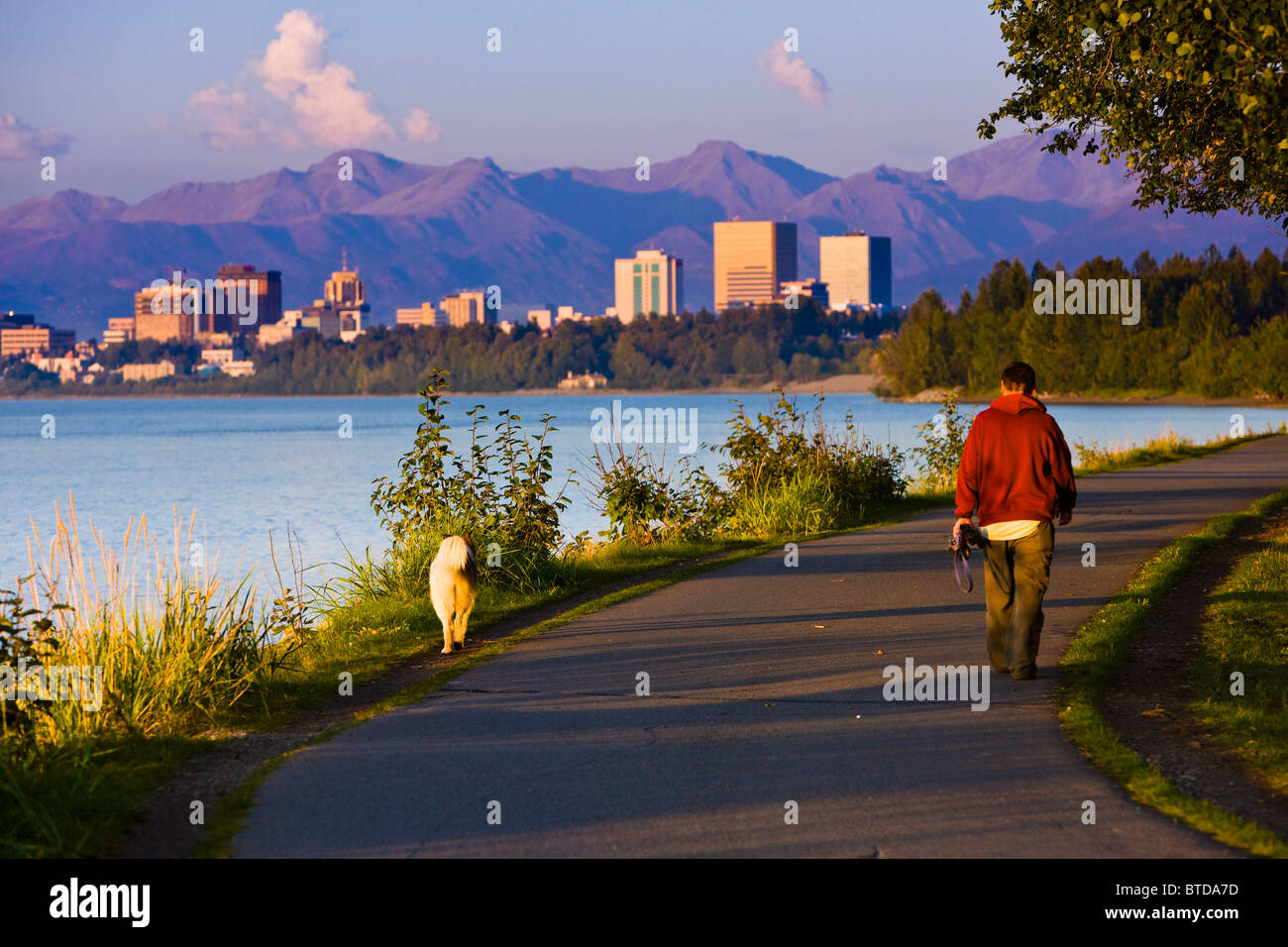 People jogging, walking and biking on the Coastal Trail with downtown ...