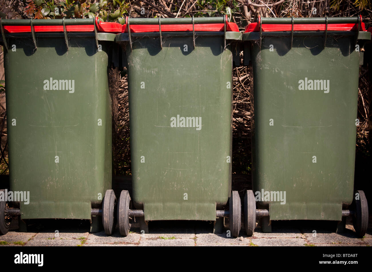 Row of wheelie bins hi-res stock photography and images - Alamy