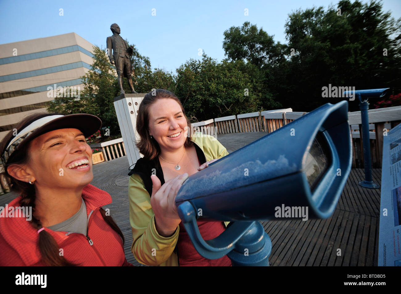 Two women at Resolution Park with the Captain James Cook statue in the ...