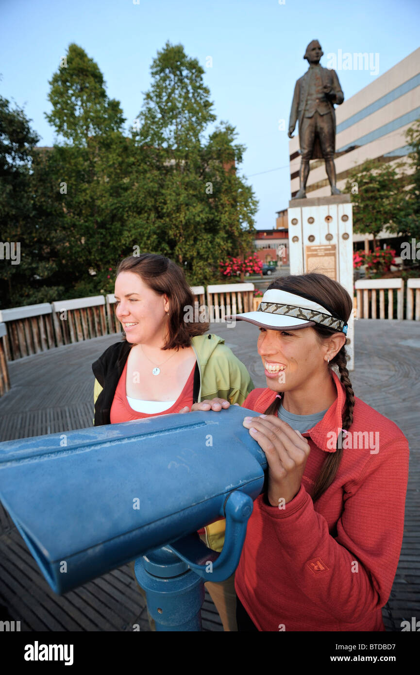 Two women at Resolution Park with the Captain James Cook statue in the ...