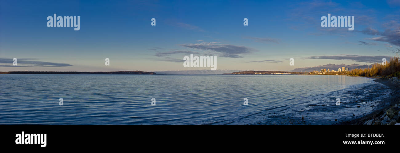 View of the Anchorage skyline reflecting in the waters of Cook Inlet at ...
