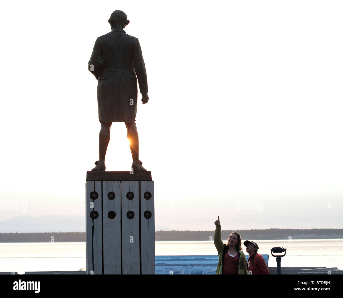 Two women view the Captain James Cook statue at Resolution Park in ...