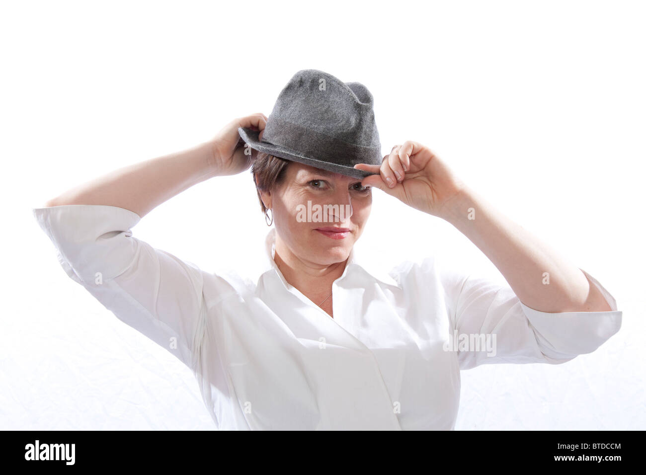 Adjusting headgear hi-res stock photography and images - Alamy