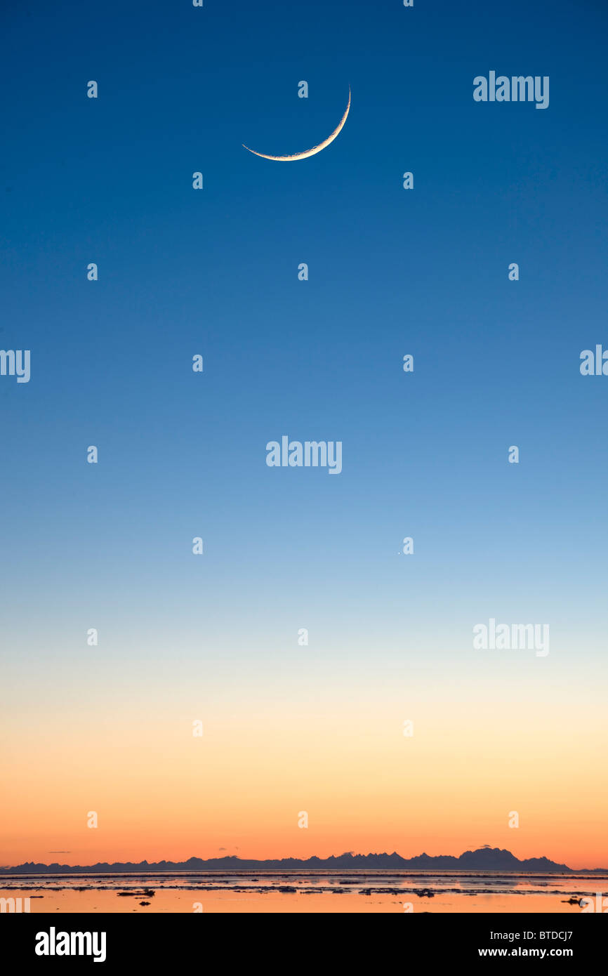 Cresent moon rising at sunset over Cook Inlet near Elderberry Park in ...