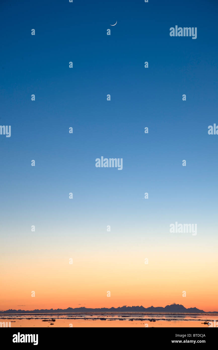 Cresent moon rising at sunset over Cook Inlet near Elderberry Park in ...