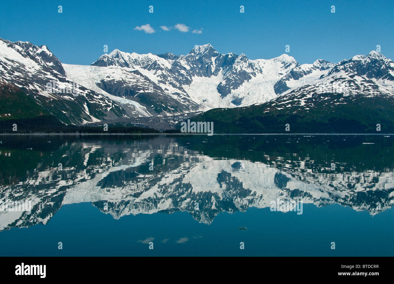 Tidewater glaciers reflecting in the waters of Harriman Fjord, Barry ...