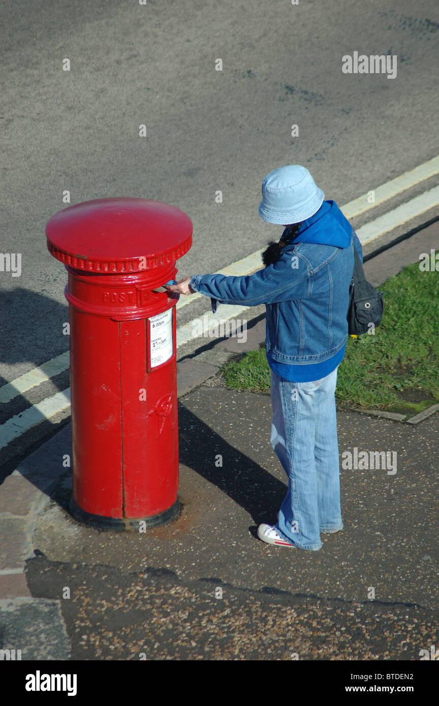 Woman posting letter in post hi-res stock photography and images - Alamy