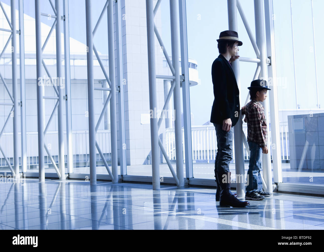 Father and son standing Stock Photo - Alamy