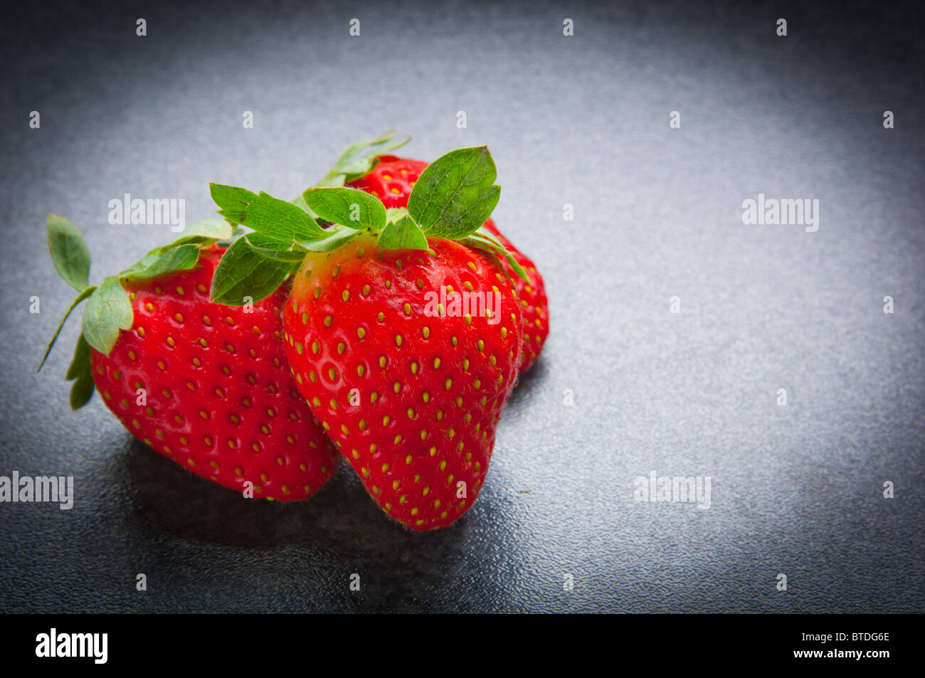 Three whole strawberries hi-res stock photography and images - Alamy
