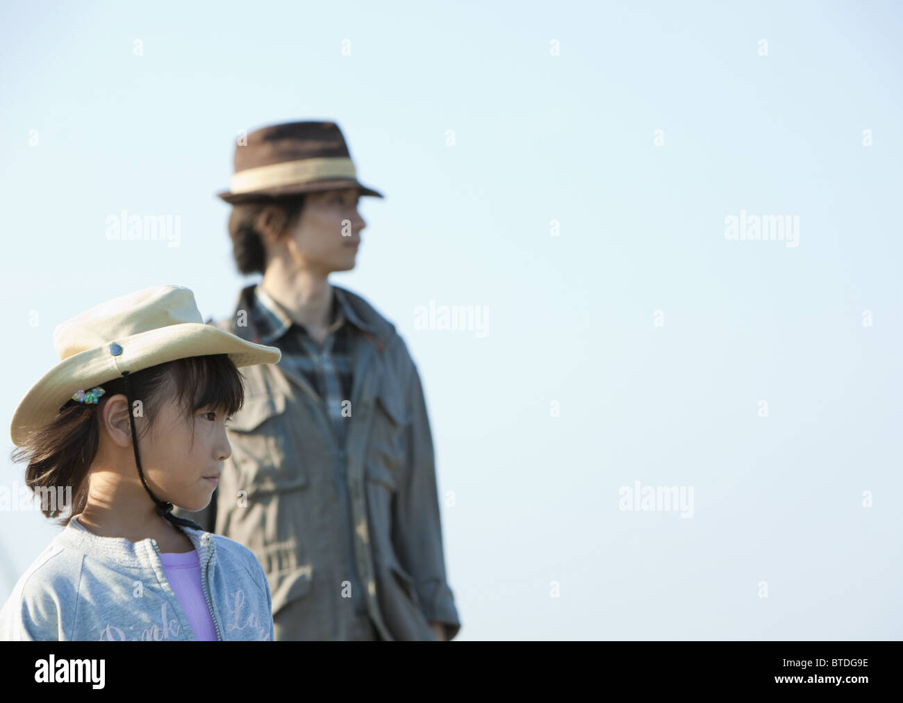 Father and daughter looking away Stock Photo - Alamy