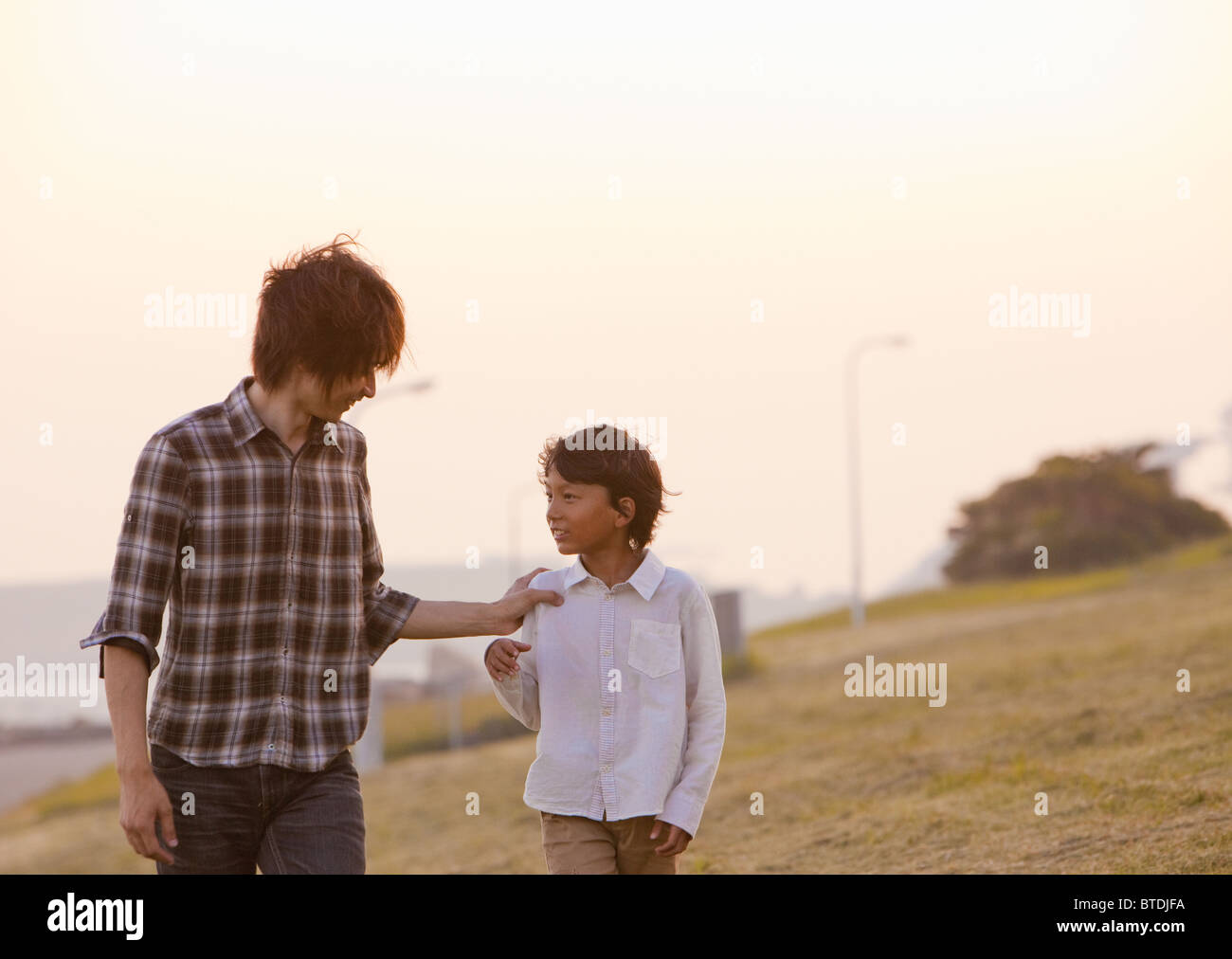 Father and son talking Stock Photo - Alamy