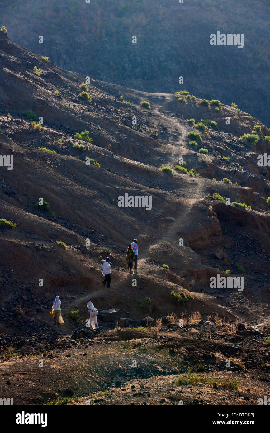 Locals walking up a path on a mountainside Stock Photo - Alamy