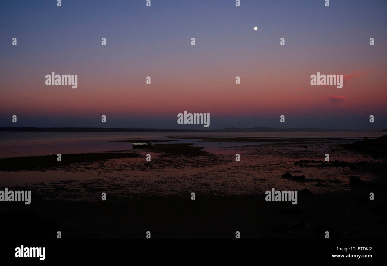 Churchaven lagoon at sunset with the full moon Stock Photo - Alamy