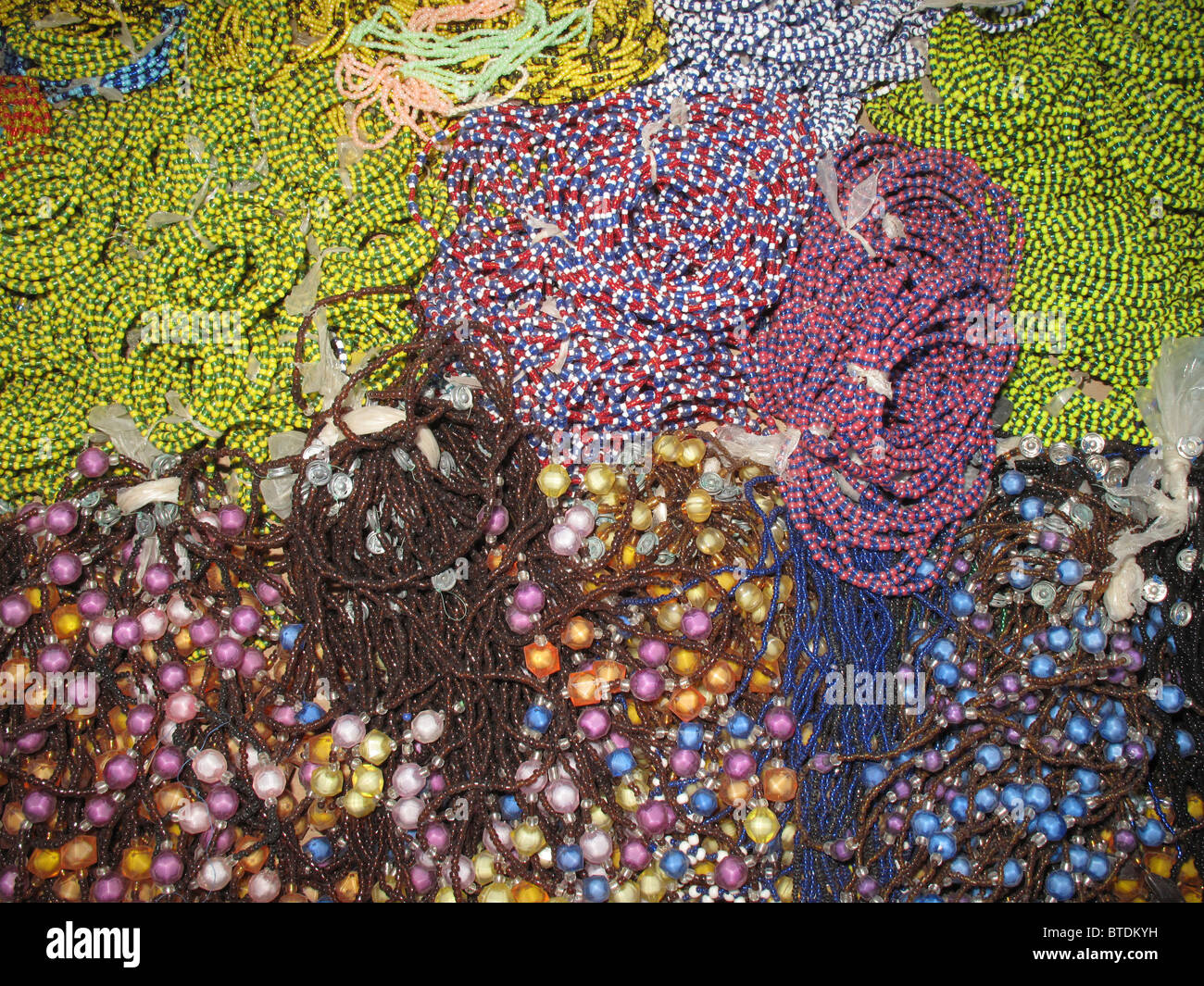 Locally produced beaded necklaces for sale and on display at a market ...