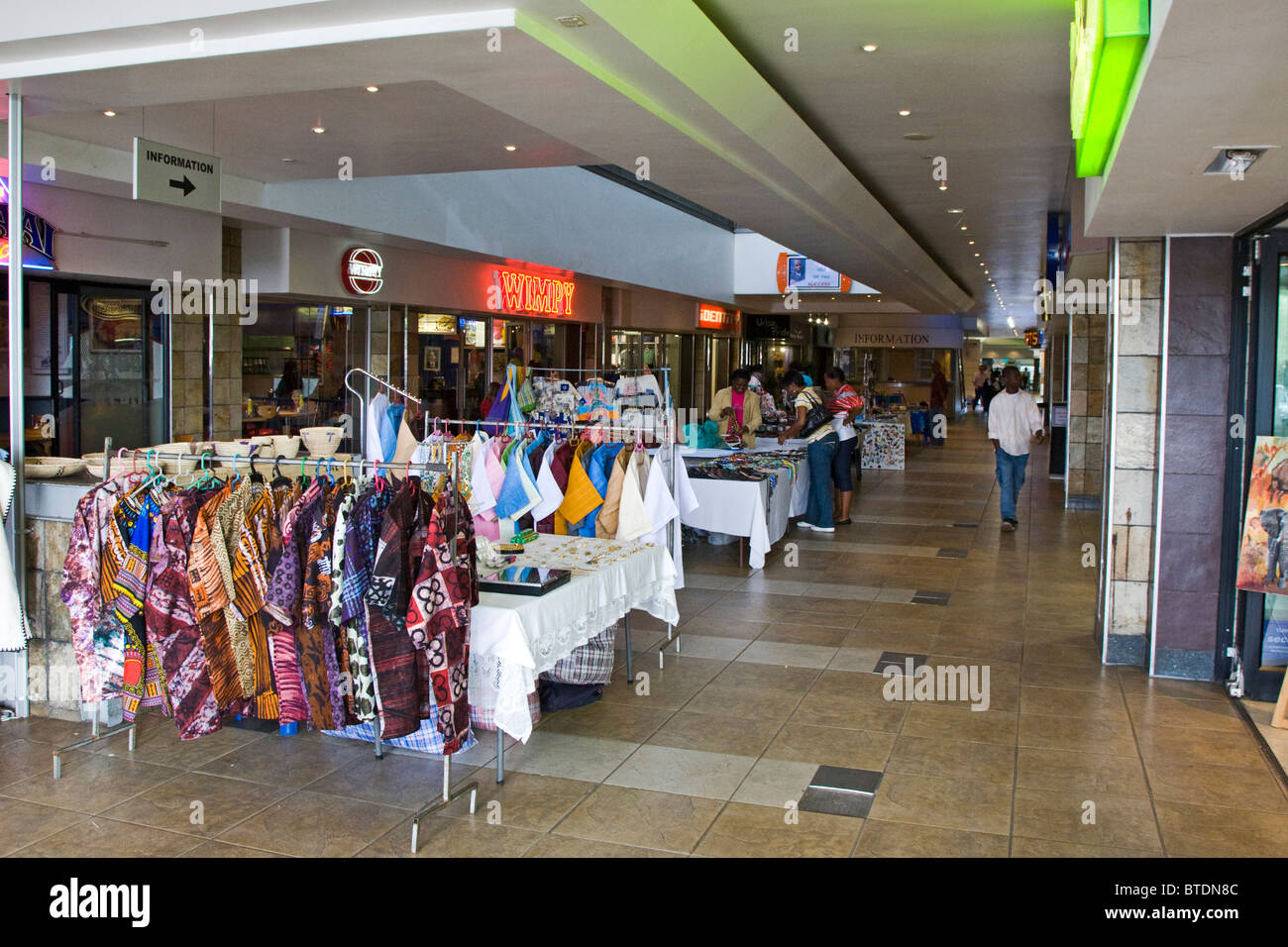 Riverwalk Shopping Mall with brightly coloured goods on display outside ...