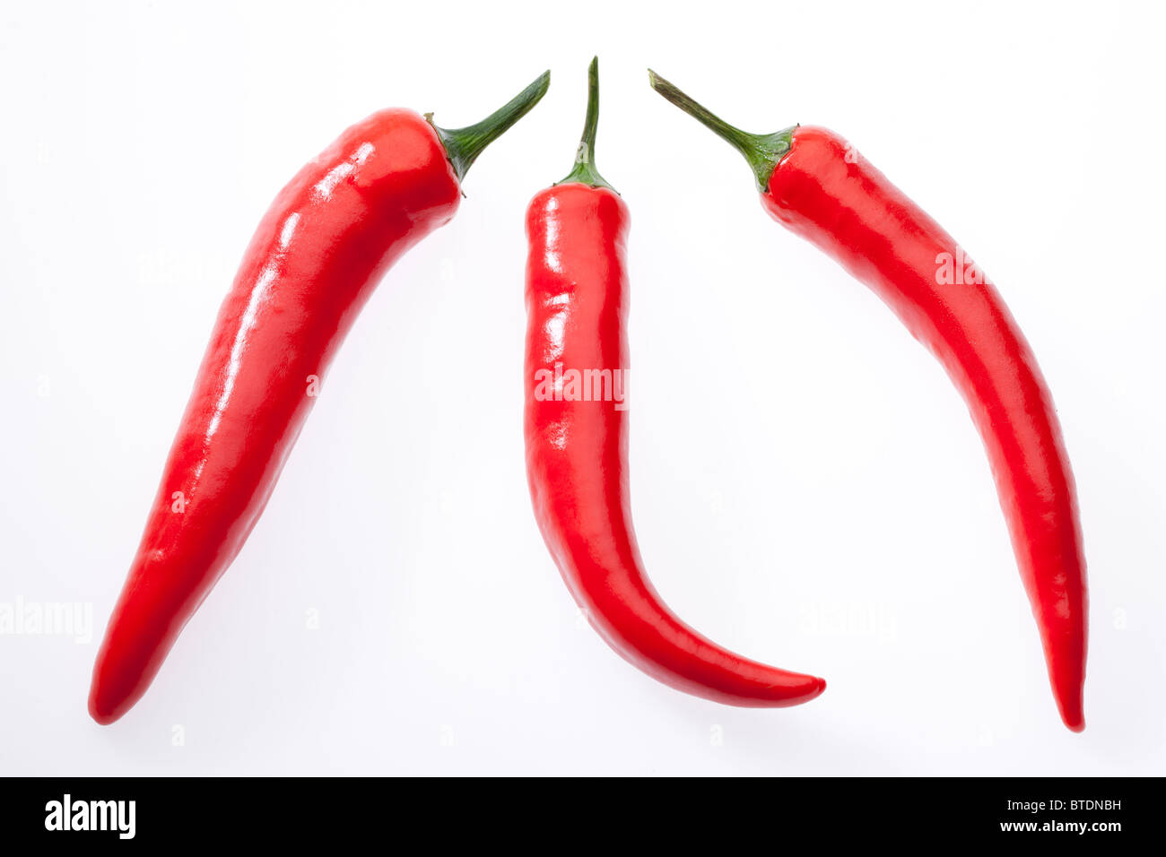 Three raw chilli fruits Stock Photo - Alamy