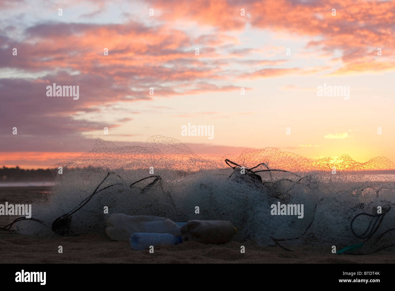 Fishing nets on the beach at sunset Stock Photo - Alamy