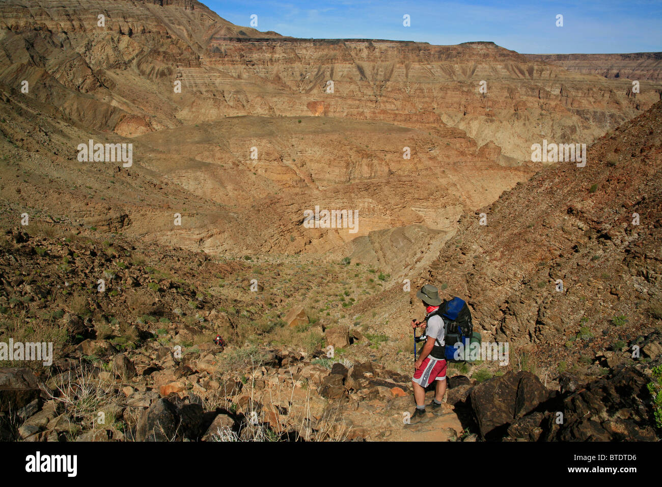 A hiker looking at the view of Fish River Canyon Stock Photo - Alamy