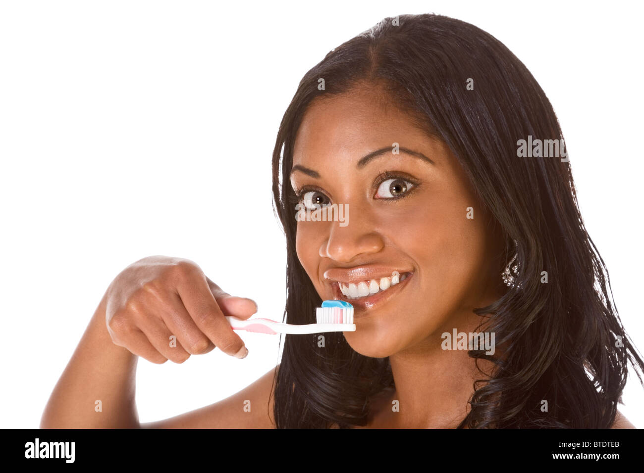 Portrait of black woman holding toothbrush with blue toothpaste and ...